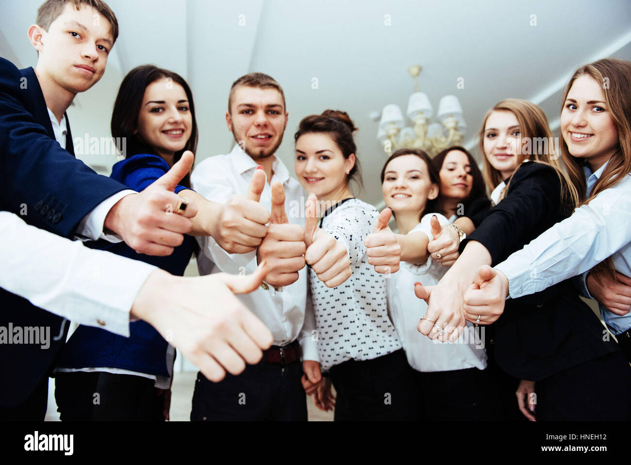 group of students looking happy and smiling Stock Photo - Alamy