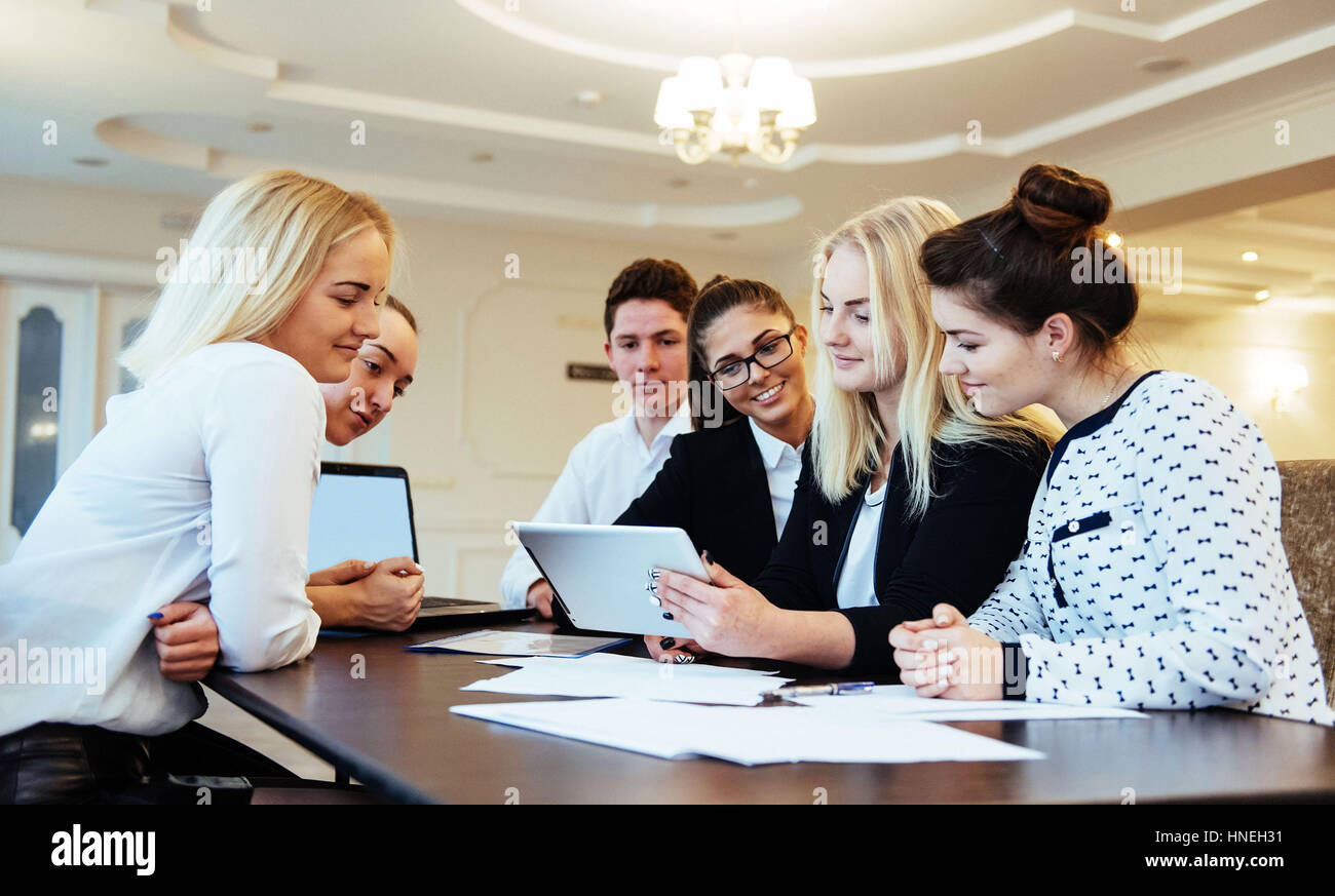 Group of students studying using a laptop Stock Photo - Alamy