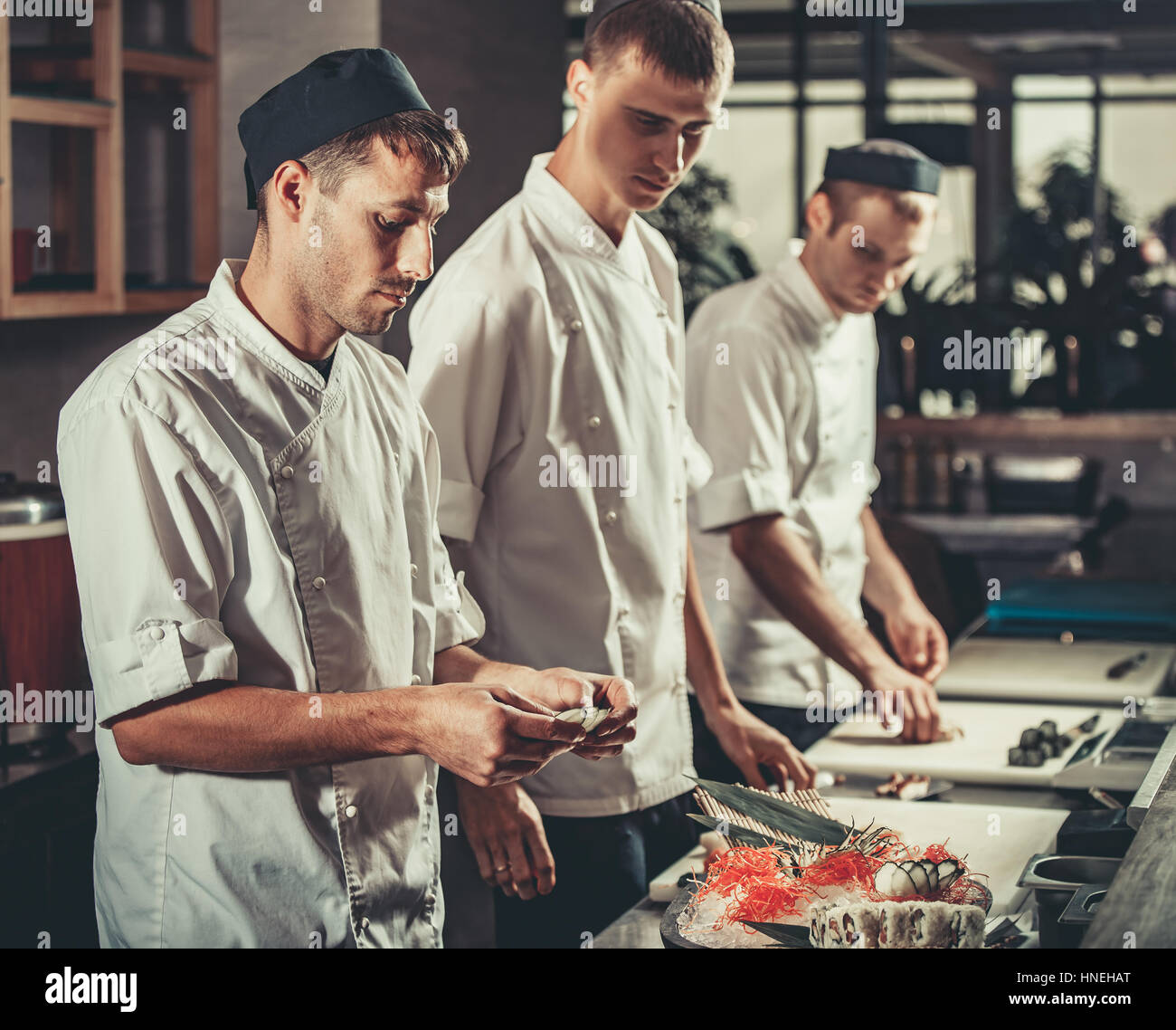 Preparing sushi set in restaurant kitchen Stock Photo - Alamy