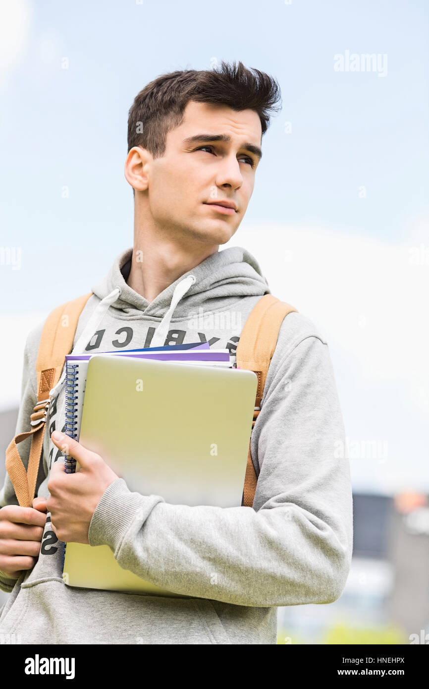 College student standing books backpack hi-res stock photography and ...