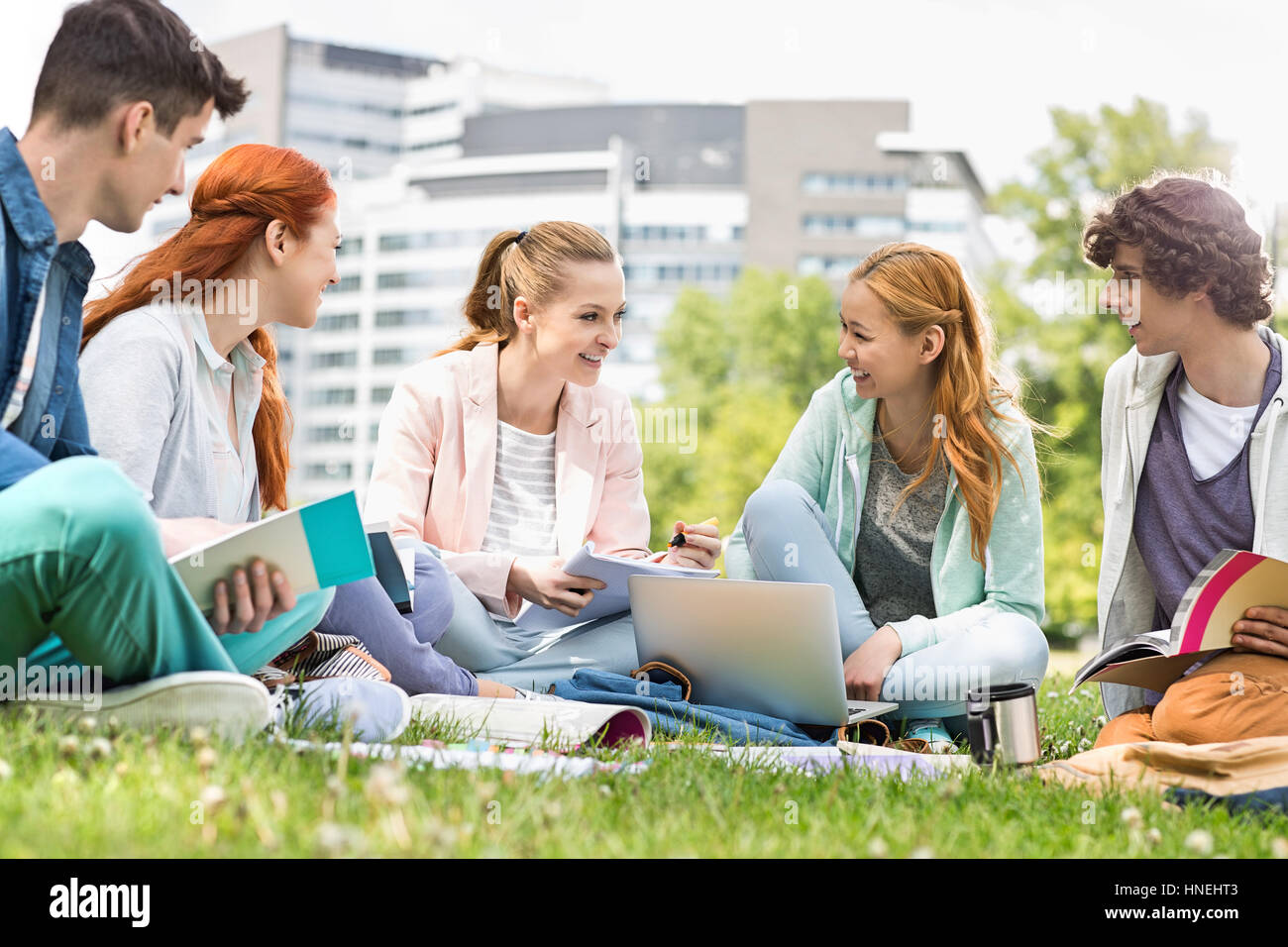 University students studying together on grass Stock Photo - Alamy