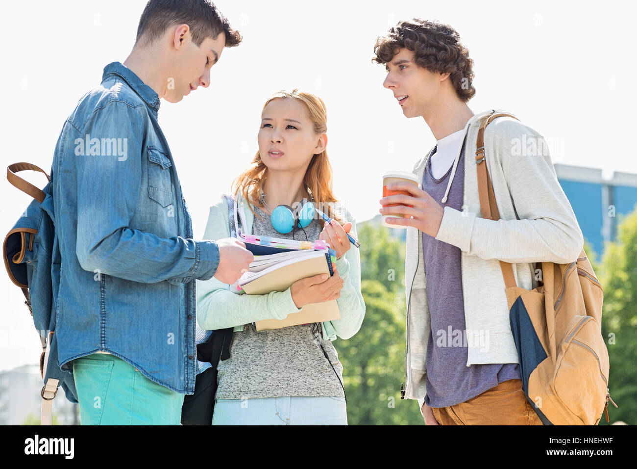 University students conversing at campus Stock Photo - Alamy