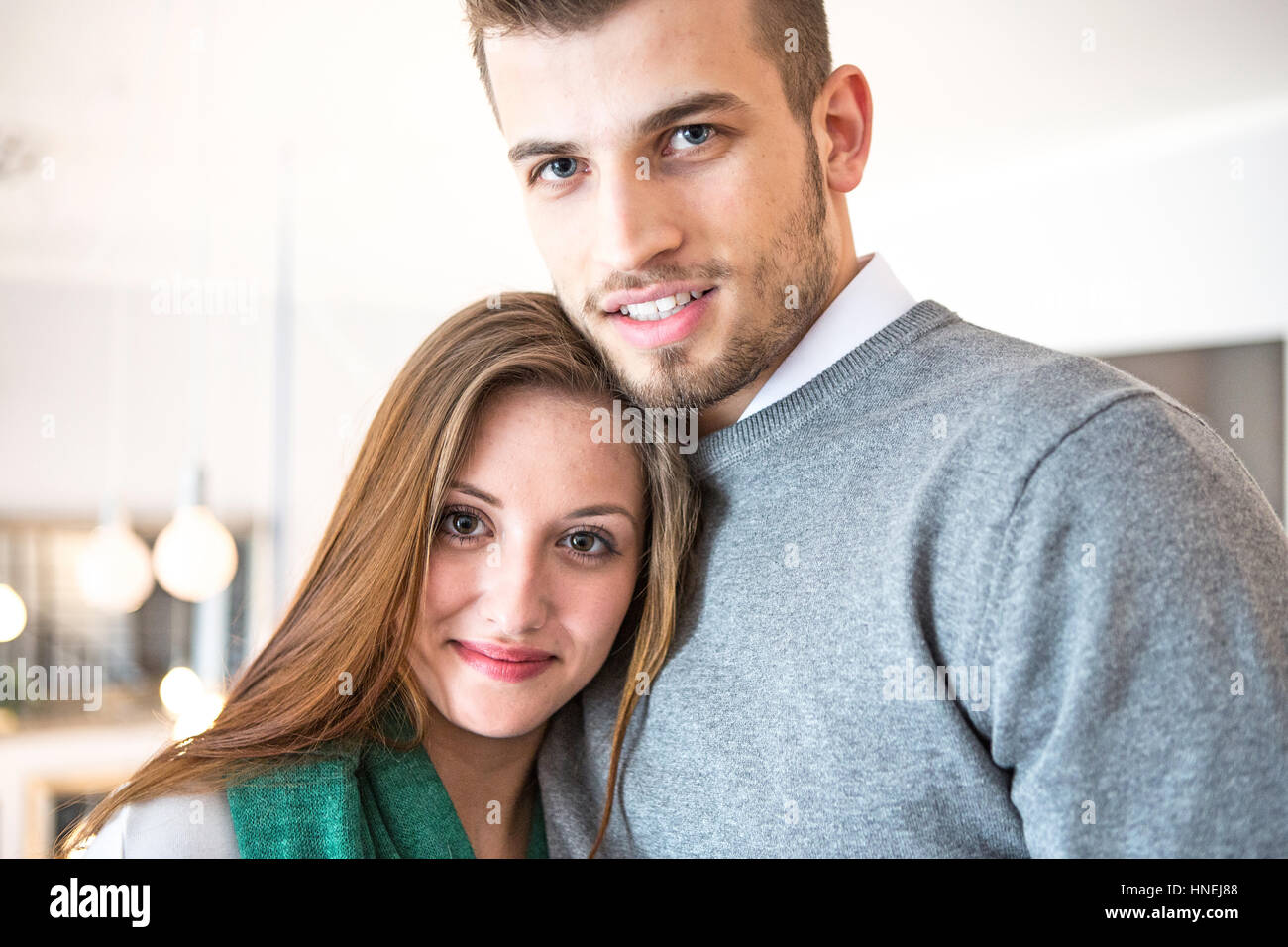 Portrait of confident young couple at cafe Stock Photo - Alamy