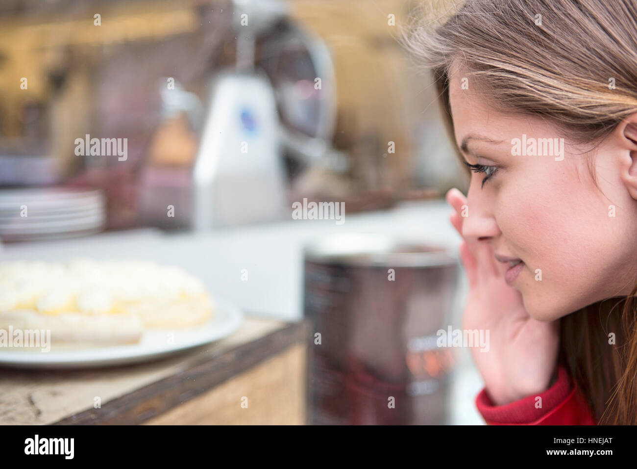 Women looking at cake display hi-res stock photography and images - Alamy