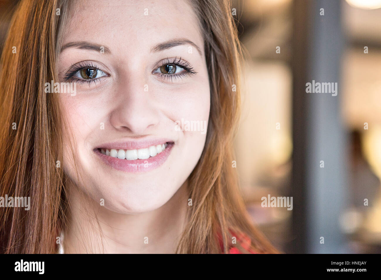 Portrait of confident woman smiling in cafe Stock Photo - Alamy Portrait of confident woman smiling in cafe Stock Photo - Alamy