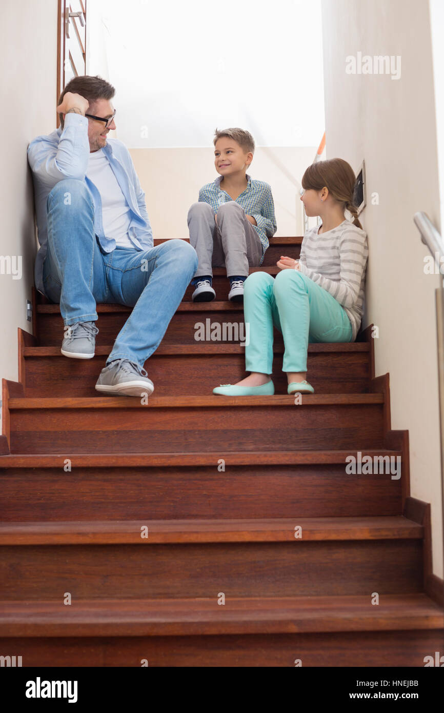 Girl sitting on steps hi-res stock photography and images - Alamy