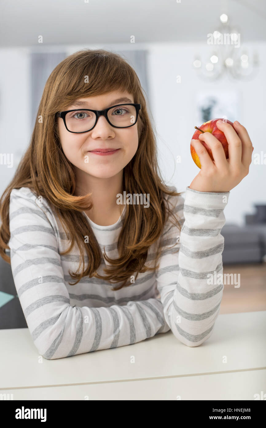 Teenage girl eating fruit hi-res stock photography and images - Alamy