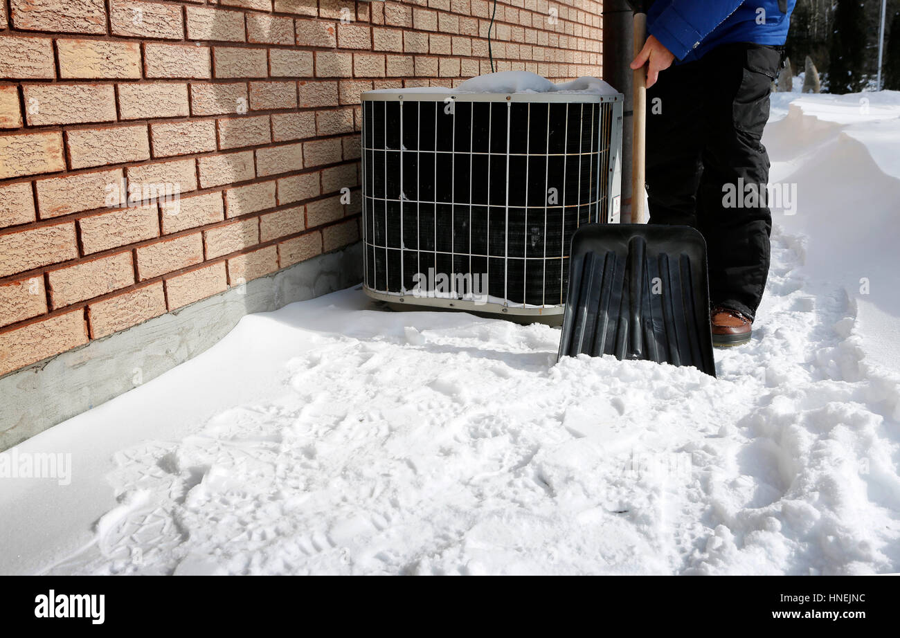 Old man shoveling snow hi-res stock photography and images - Alamy
