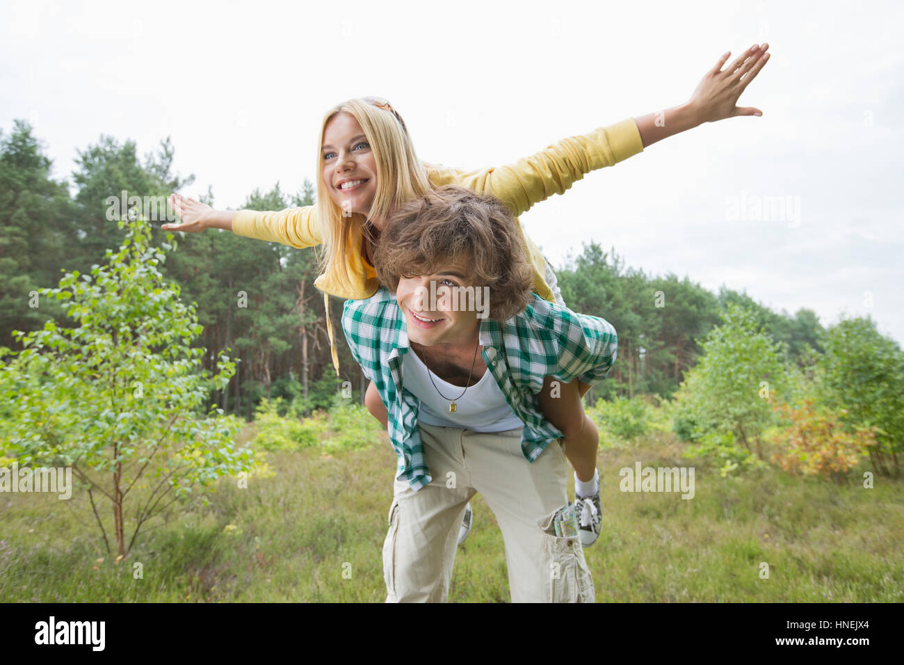 Young couple enjoying piggyback ride hi-res stock photography and ...