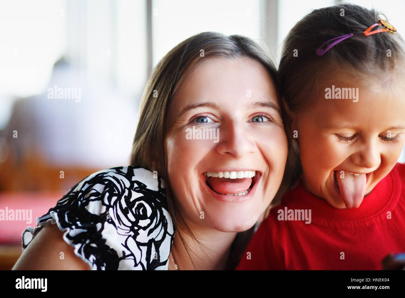 Happy mother and daughter laughing together. Funny family. Selective ...