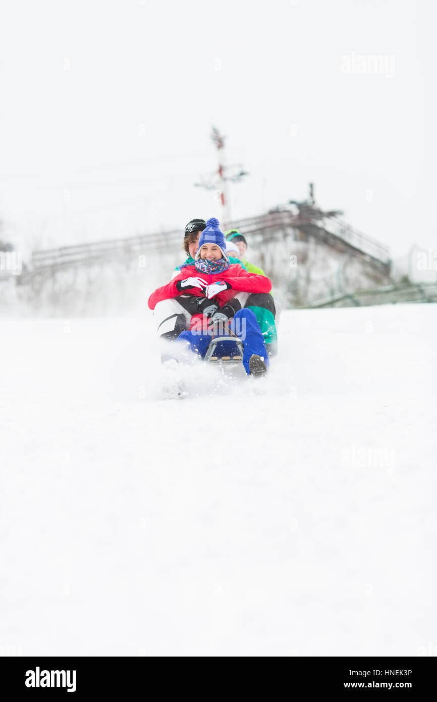 Woman enjoying riding sled hi-res stock photography and images - Alamy