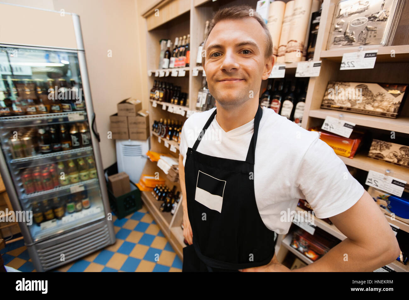 Portrait of confident mid adult salesman standing hands on hips in ...