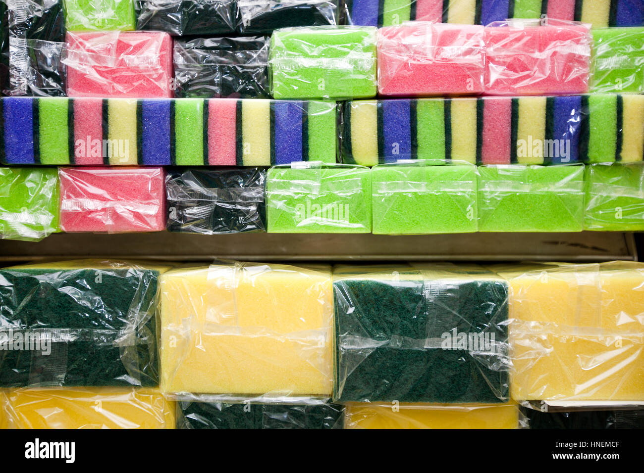 Multicolored sponges in grocery store Stock Photo - Alamy