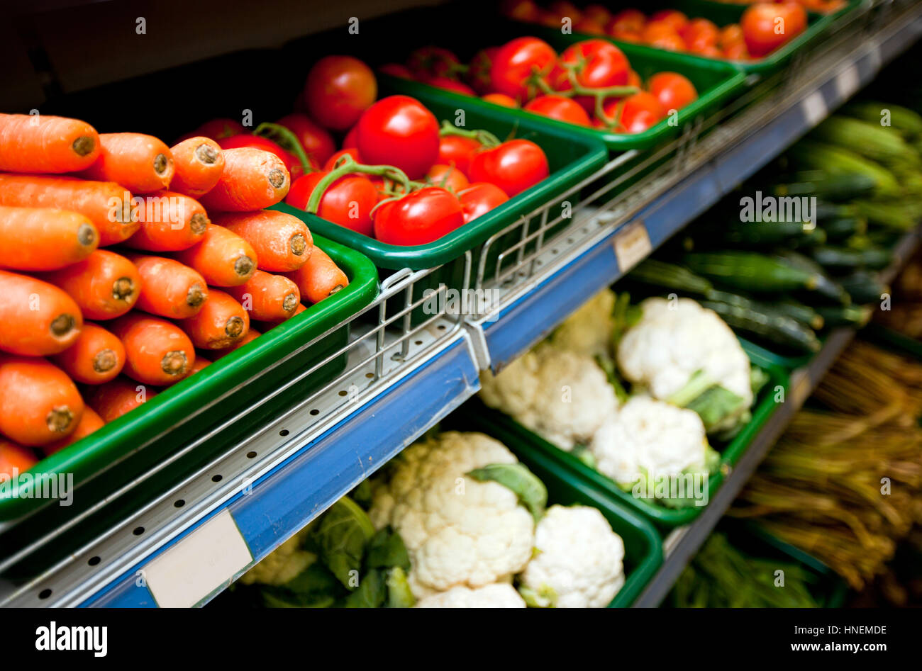 Various vegetables on display in grocery store Stock Photo - Alamy