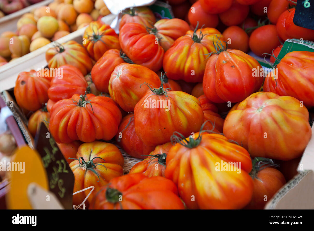Close-up of tomatoes on display in store Stock Photo - Alamy
