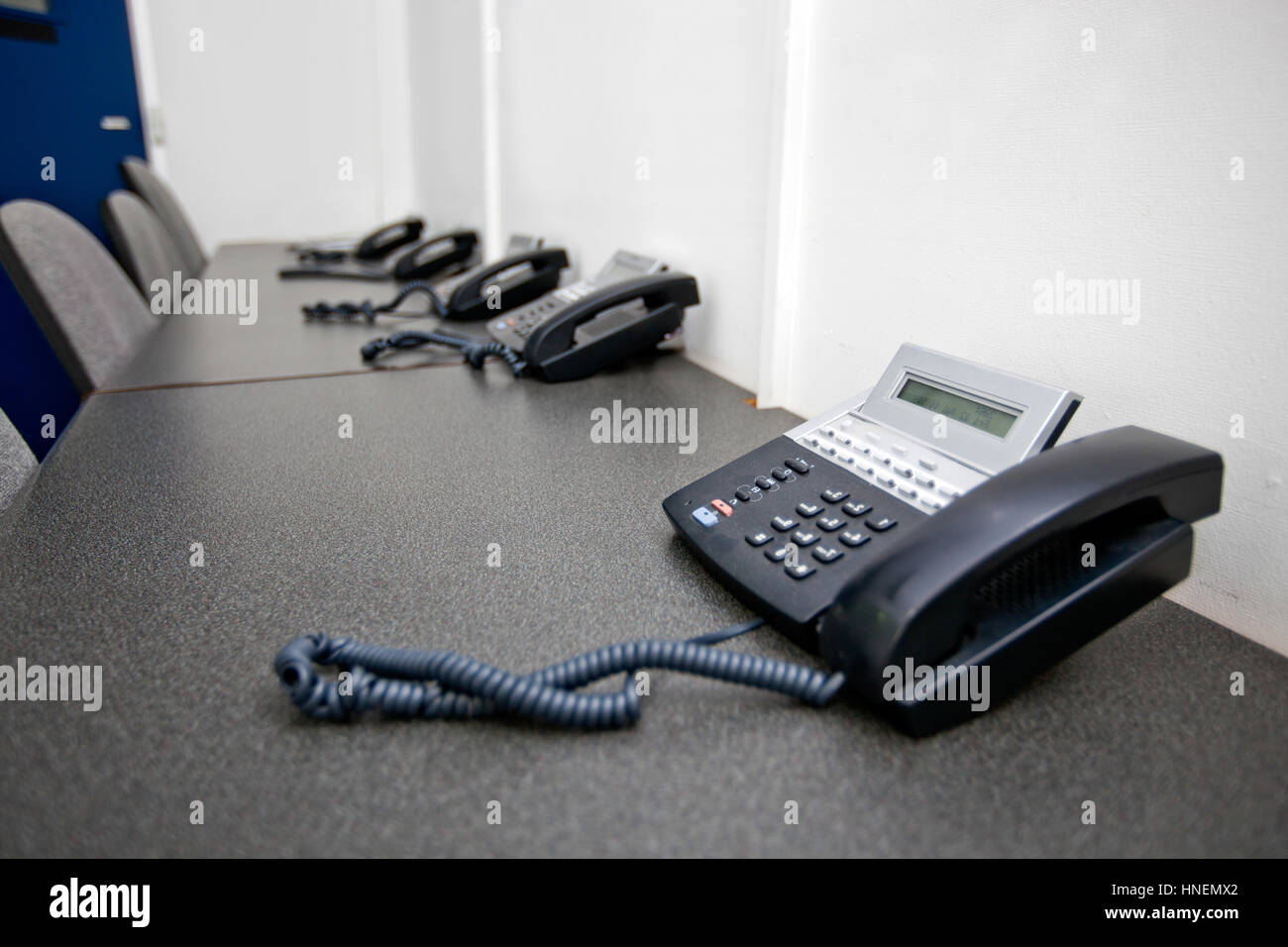 Landline telephones on table in television studio Stock Photo - Alamy