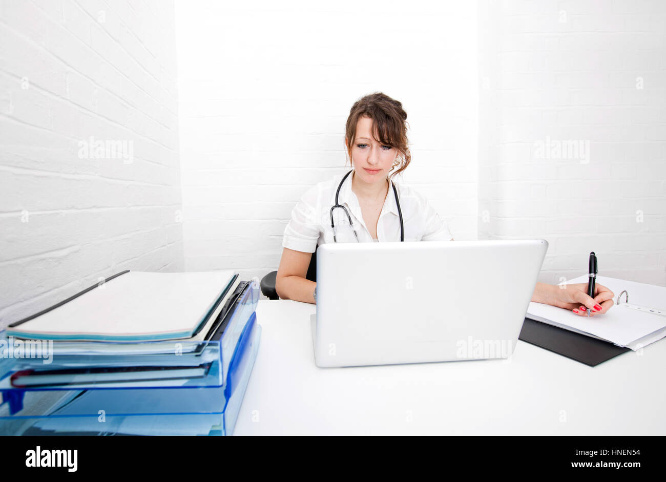 Doctor writing laptop hi-res stock photography and images - Alamy