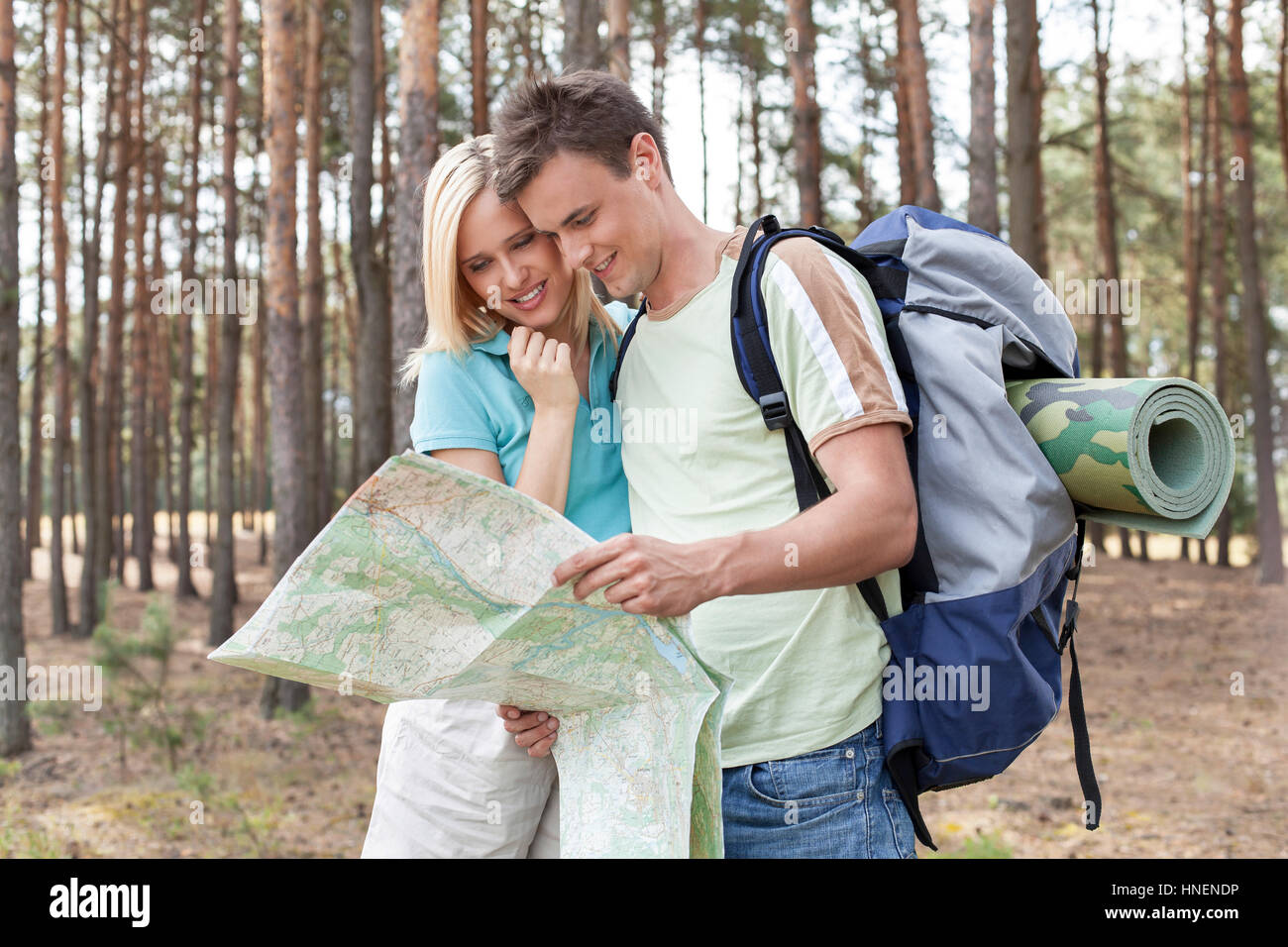 Two young men reading map forest hi-res stock photography and images ...