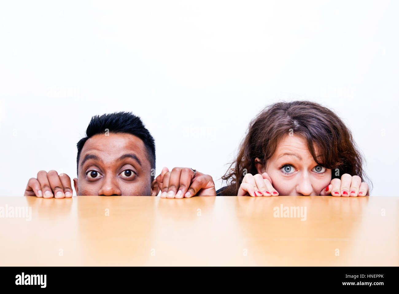 Hands peeking over edge hi-res stock photography and images - Alamy