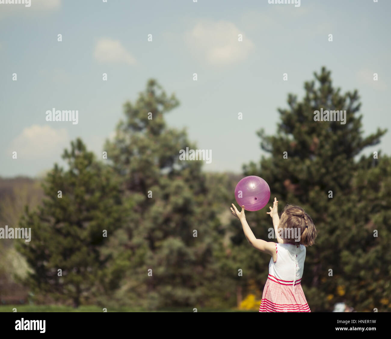 Child catching ball hi-res stock photography and images - Alamy