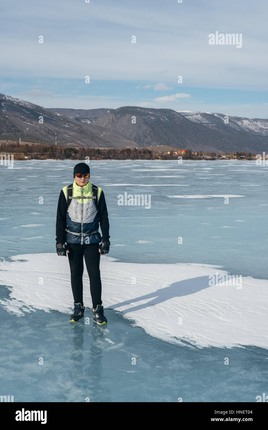 Traveler standing on ice Stock Photo - Alamy