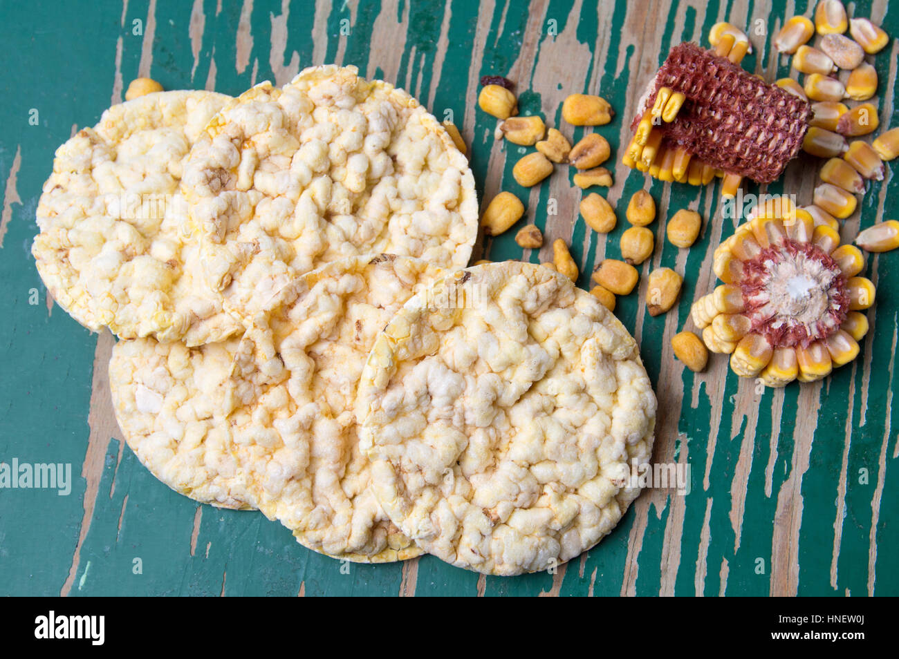 circle shaped corn snacks and corn kernels Stock Photo - Alamy