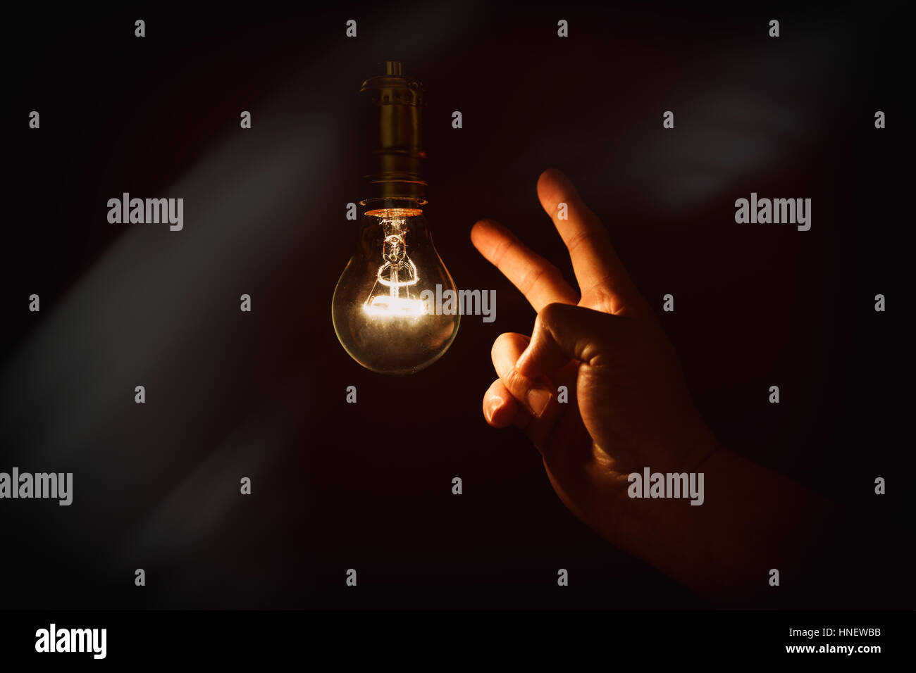 Light bulb and hand, concept of wisdom Stock Photo - Alamy