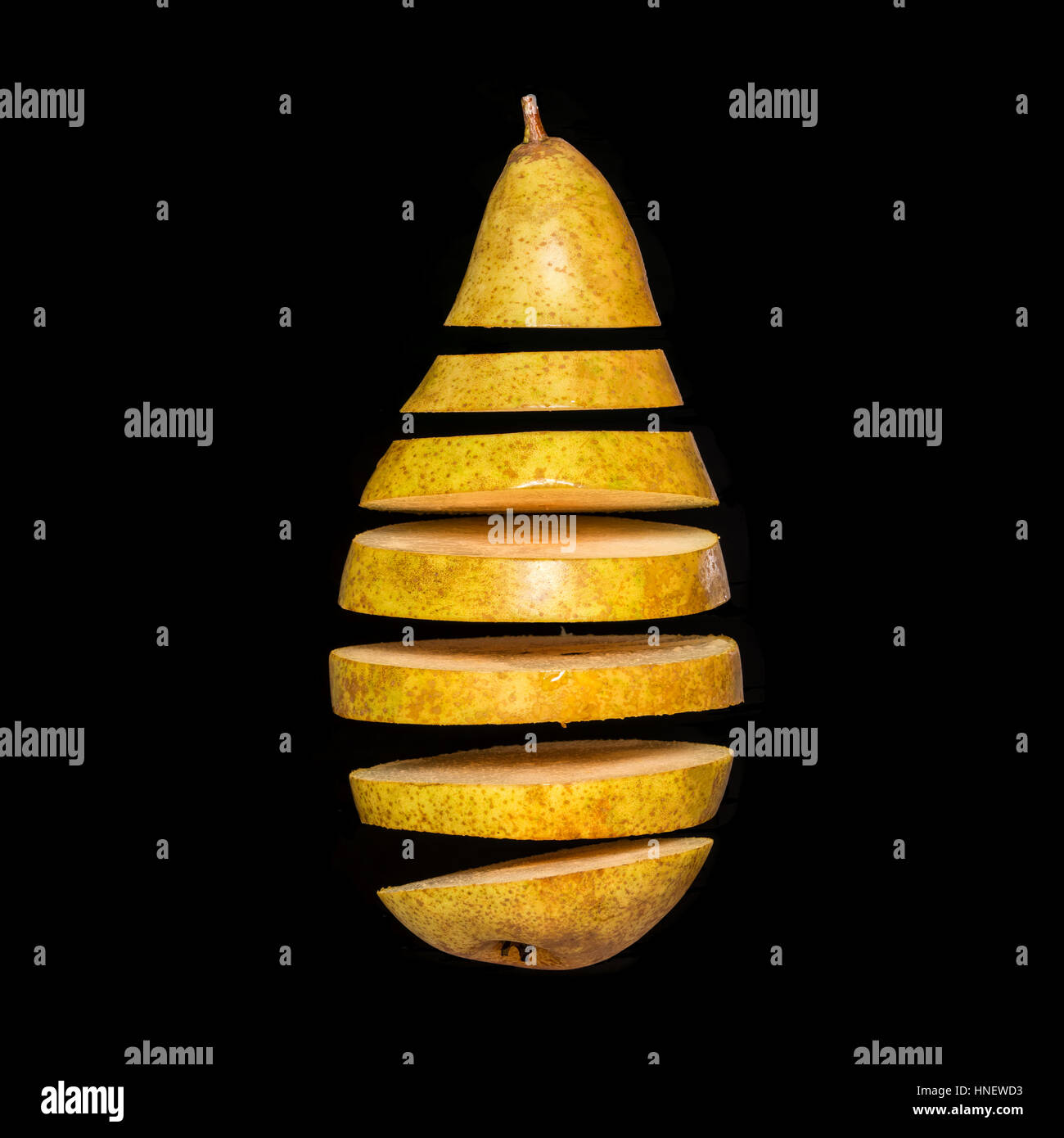 Flying pear. Sliced pear isolated on black background. Levity fruit ...