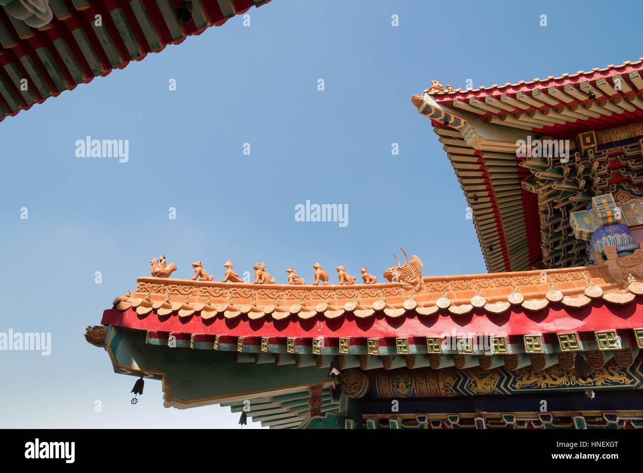 Chinese style temple roof against blue sky background Stock Photo - Alamy