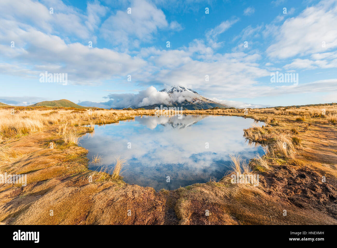 Reflection in Pouakai Tarn, stratovolcano Mount Taranaki or Mount ...