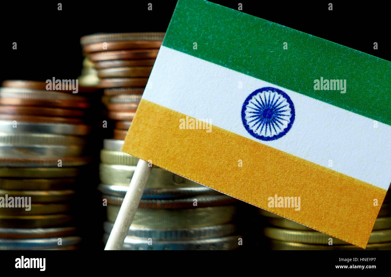 India flag waving with stack of money coins macro Stock Photo - Alamy
