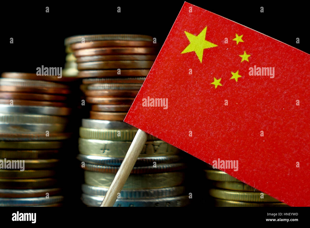 People's Republic of China flag waving with stack of money coins macro ...