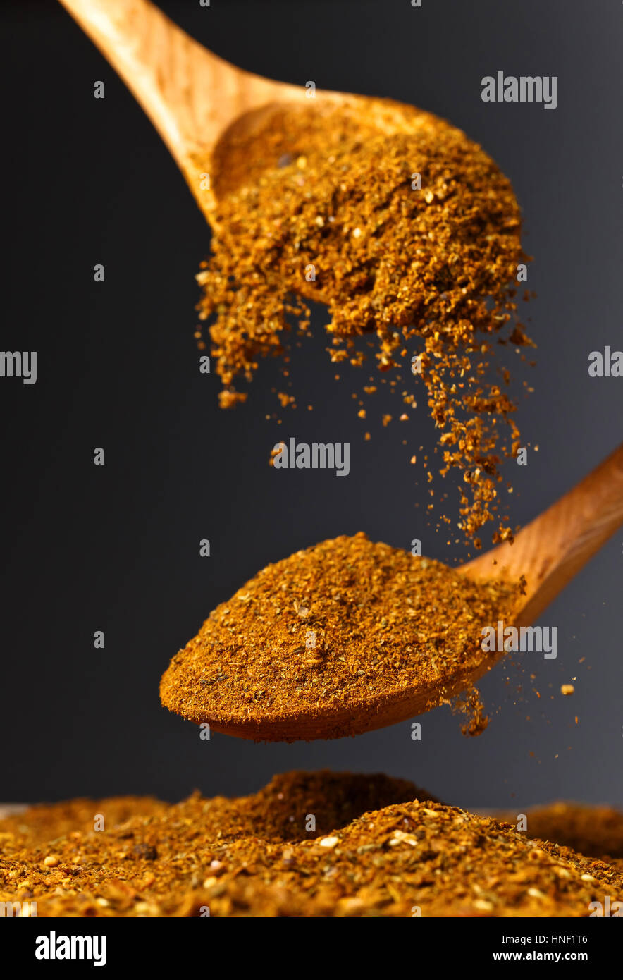 Wooden spoons with mixture of different East spices Stock Photo - Alamy