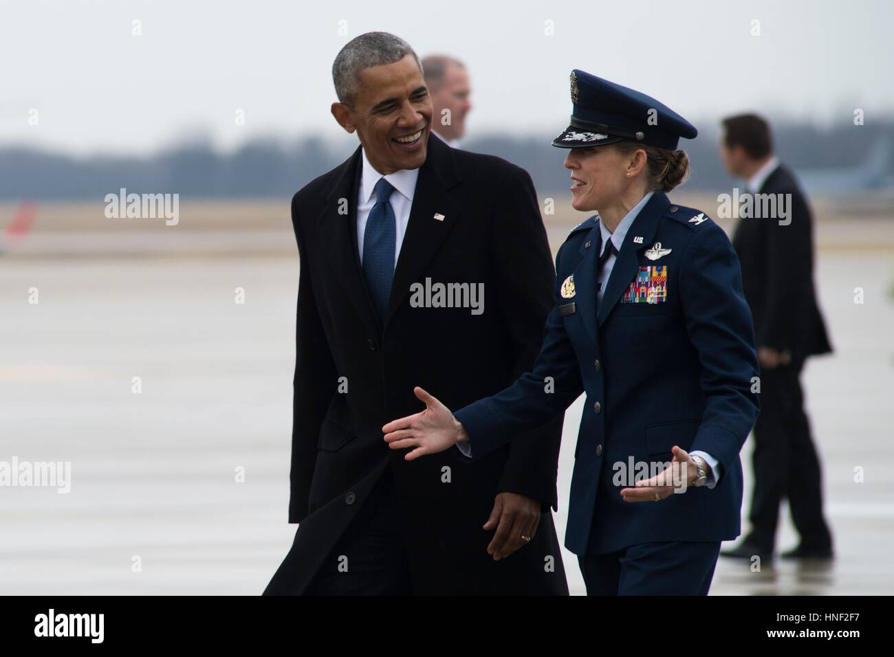 Former U.S. President Barack Obama is greeted by U.S. Air Force Vice ...