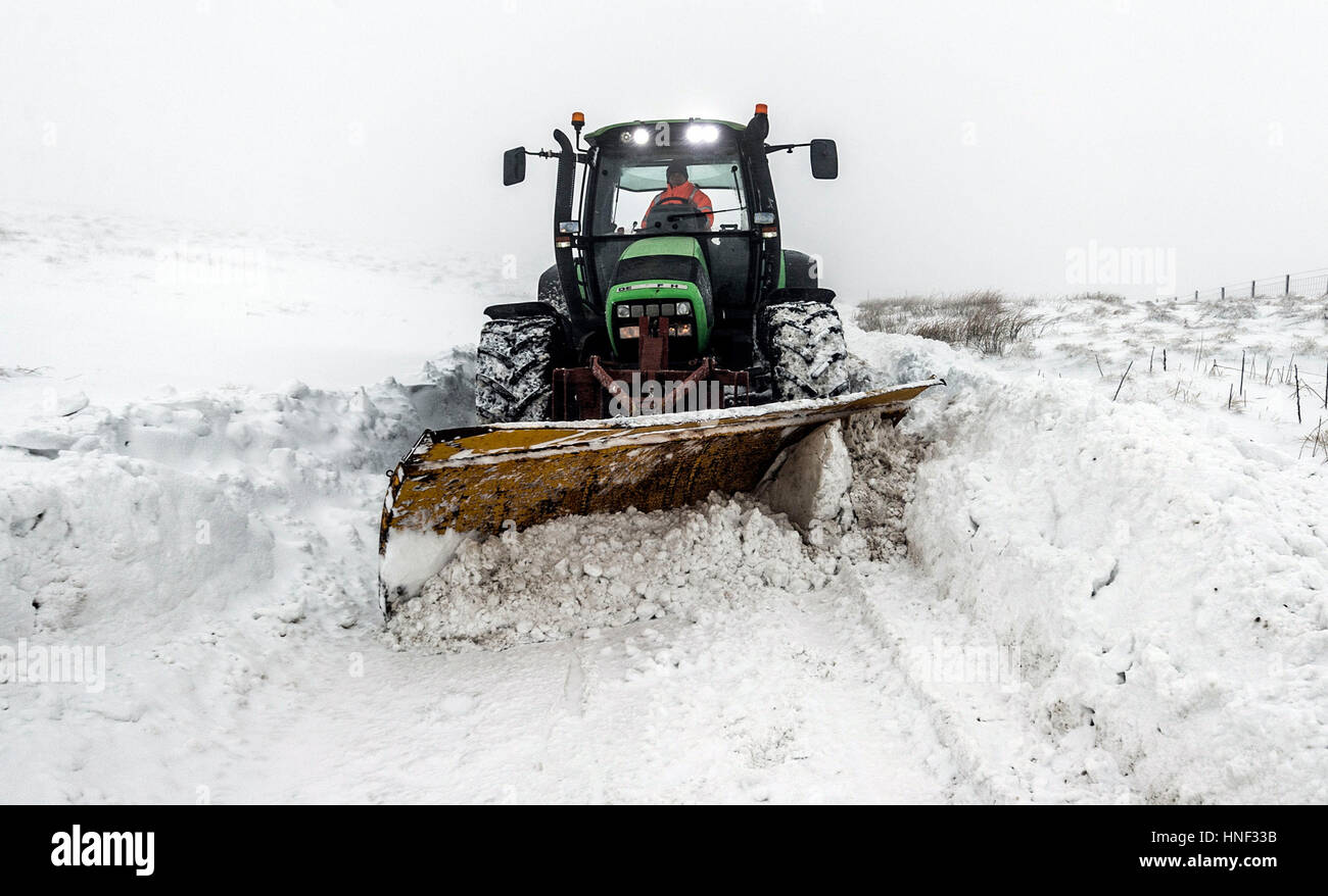 A snow plough clears a read in Fleet Moss in the Yorkshire Dales as ...