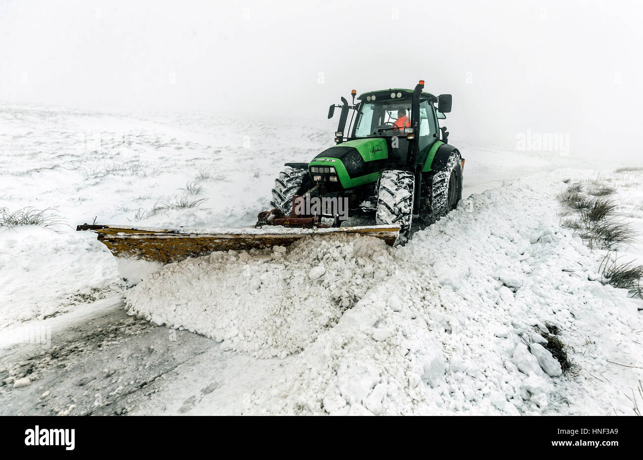 A snow plough clears a read in Fleet Moss in the Yorkshire Dales as ...