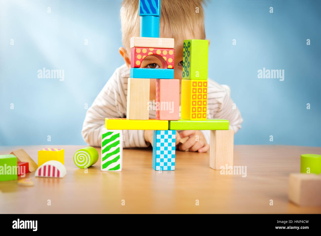 Portrait of a two years old child sitting at the table Stock Photo - Alamy