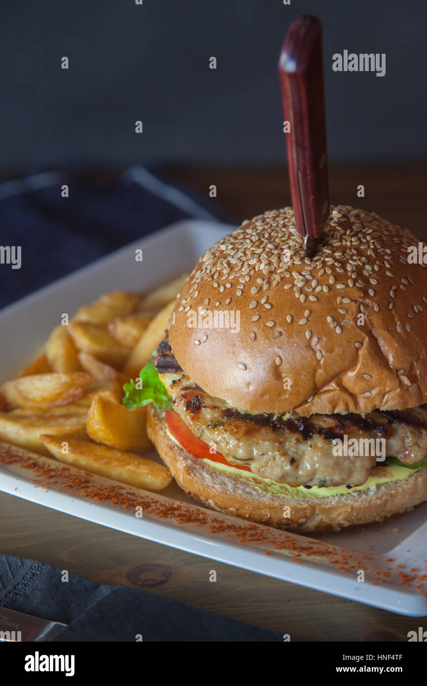 Chicken burger close up with napkin and black background Stock Photo ...