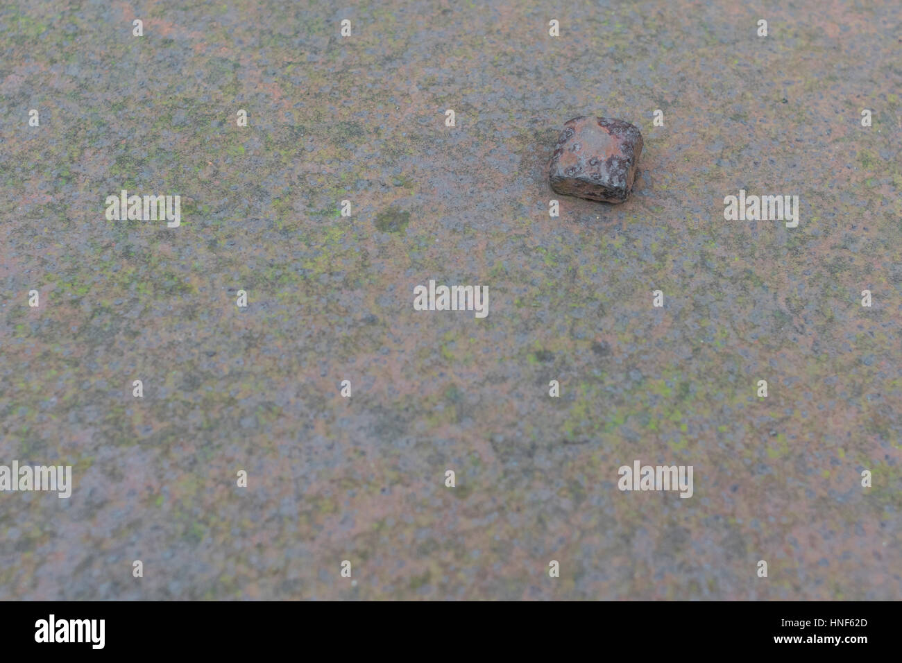 Rusty metal bolt holding together some steel / iron sheeting Stock ...