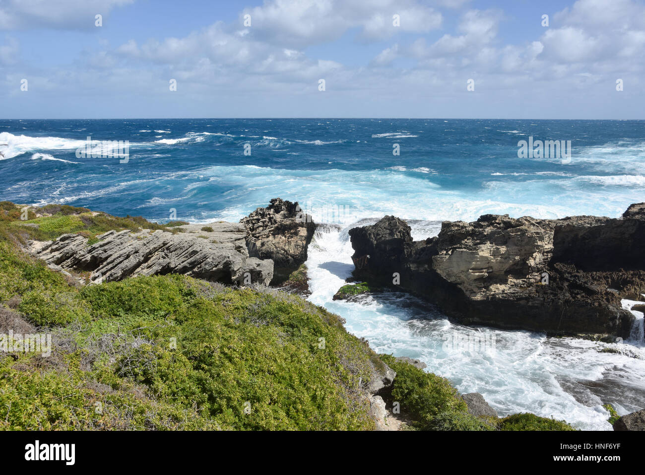 Waves rushing natural limestone inlet on the Indian Ocean coast at Cape ...