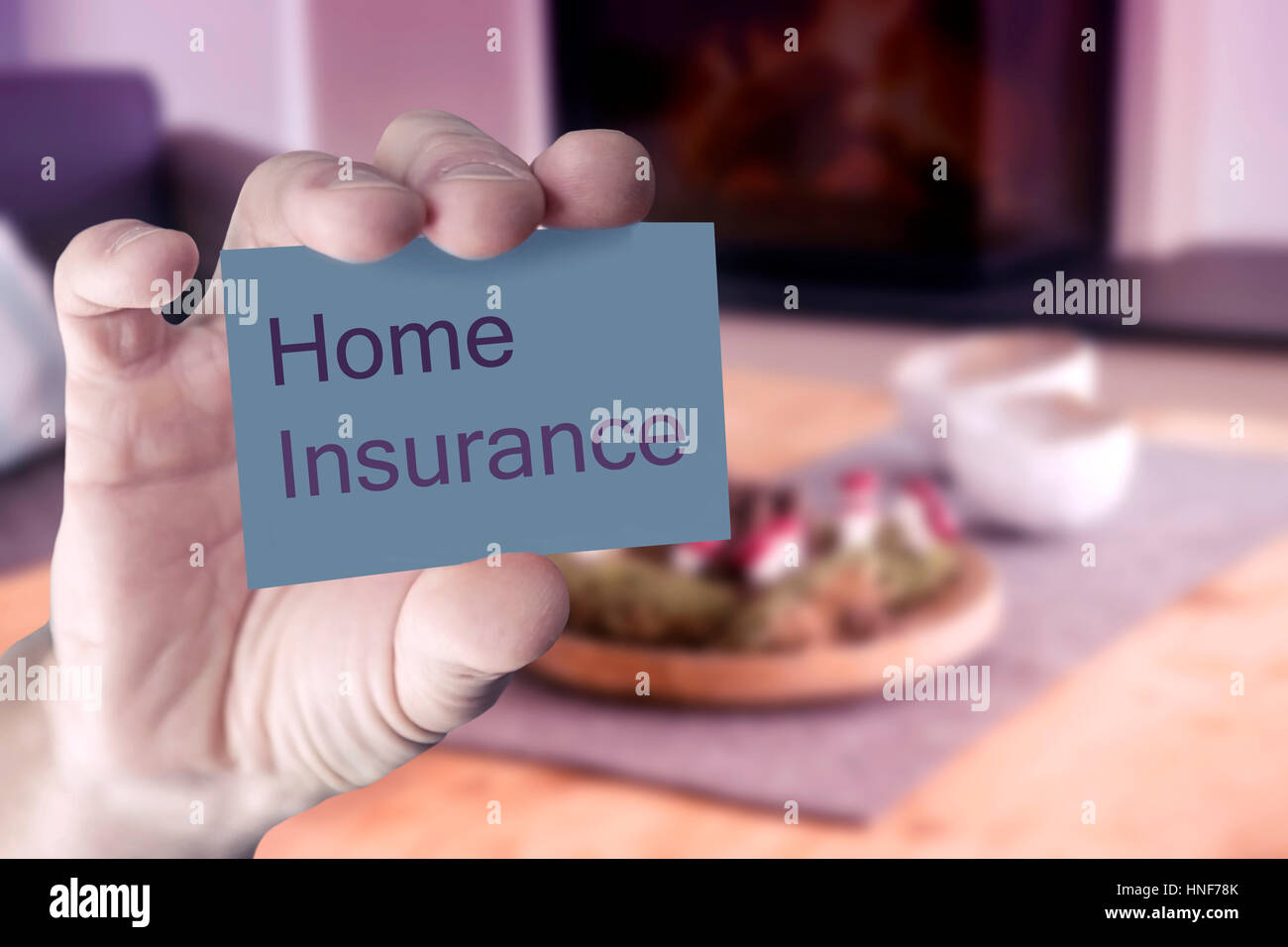 closeup of mans hand showing business card with the words Home ...