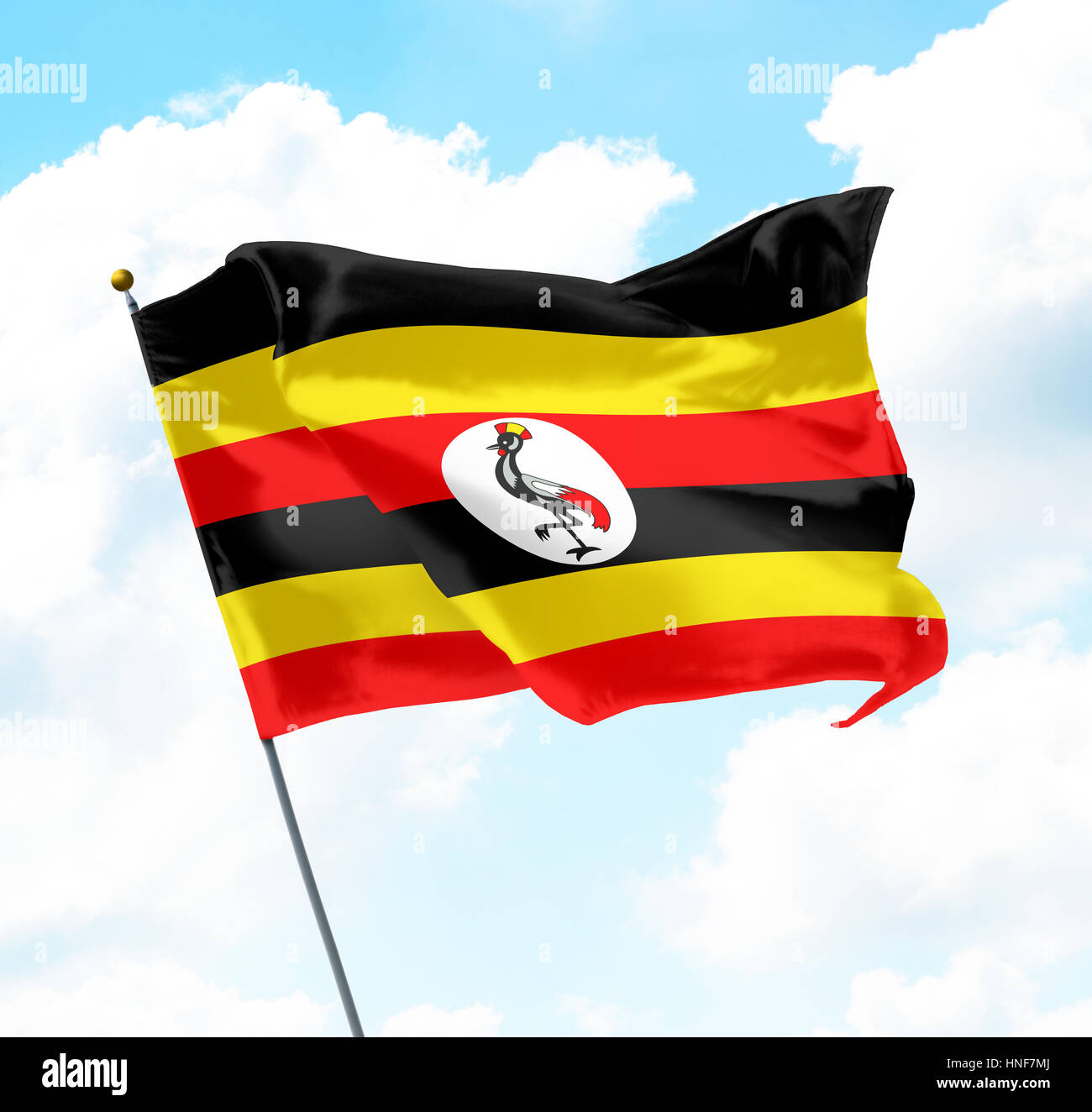 Uganda flag blowing in wind hi-res stock photography and images - Alamy