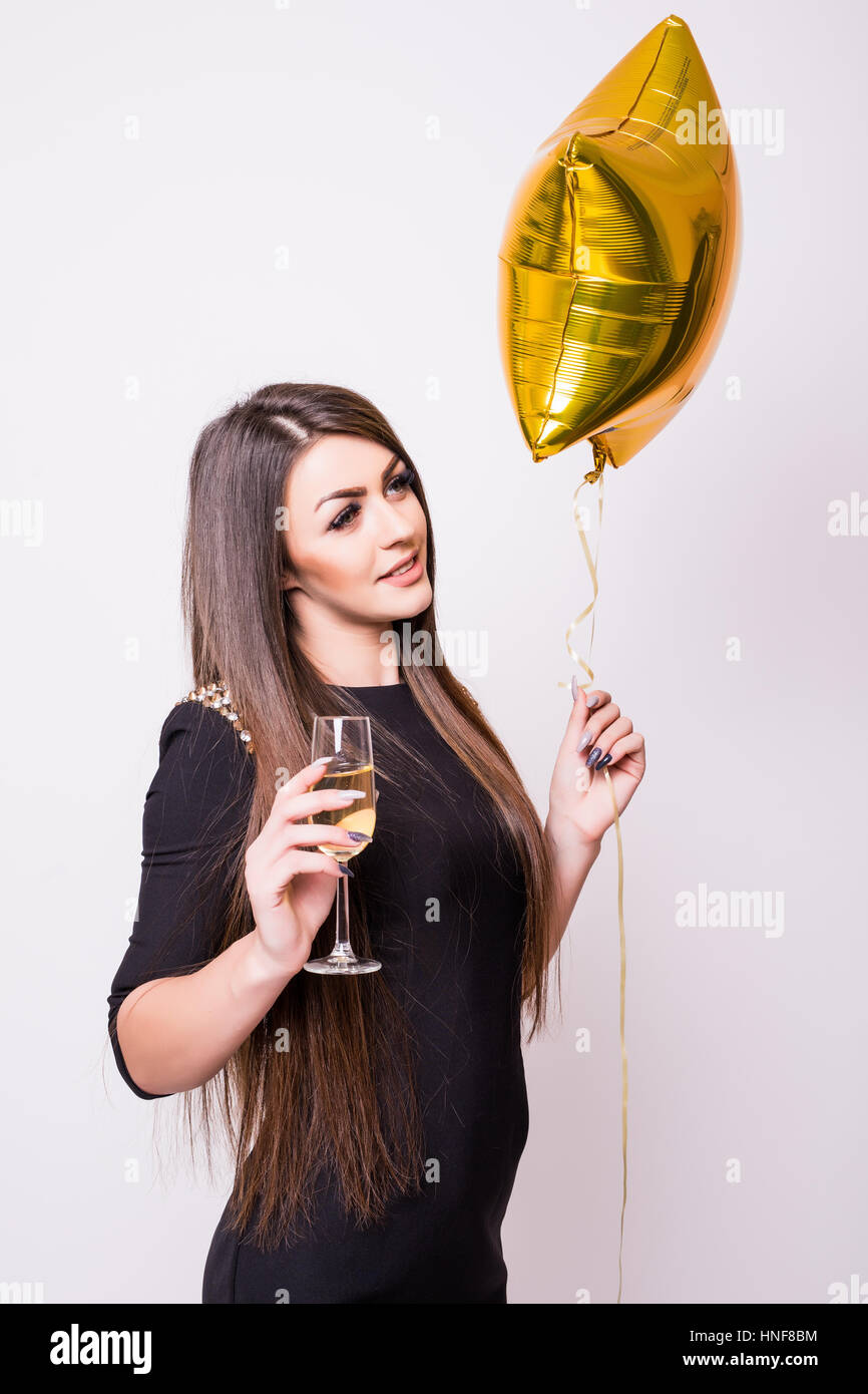 woman with star shaped balloon drinking champagne on white background ...