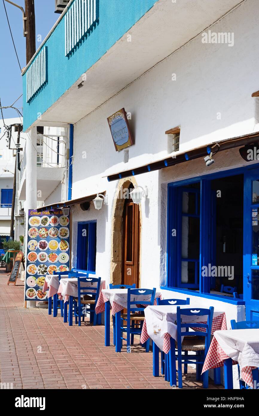 Blue tables and chairs outside a cafe, Ierapetra, Crete, Greece, Europe ...
