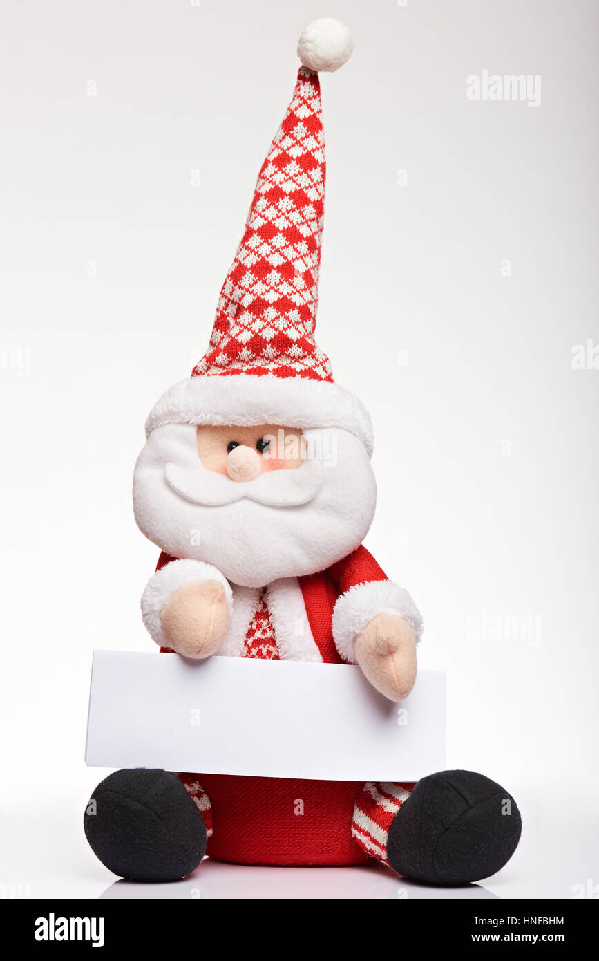 Sitting santa claus toy with horizontal banner isolated on white ...