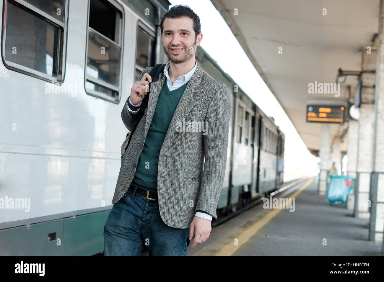 standing man waiting for the train in a train station platform Stock ...