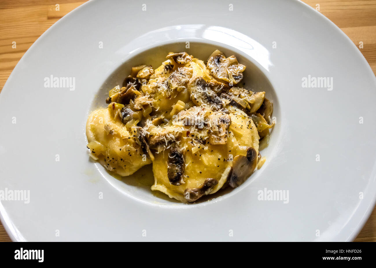 Mezzelune stuffed pasta with mushrooms Stock Photo - Alamy
