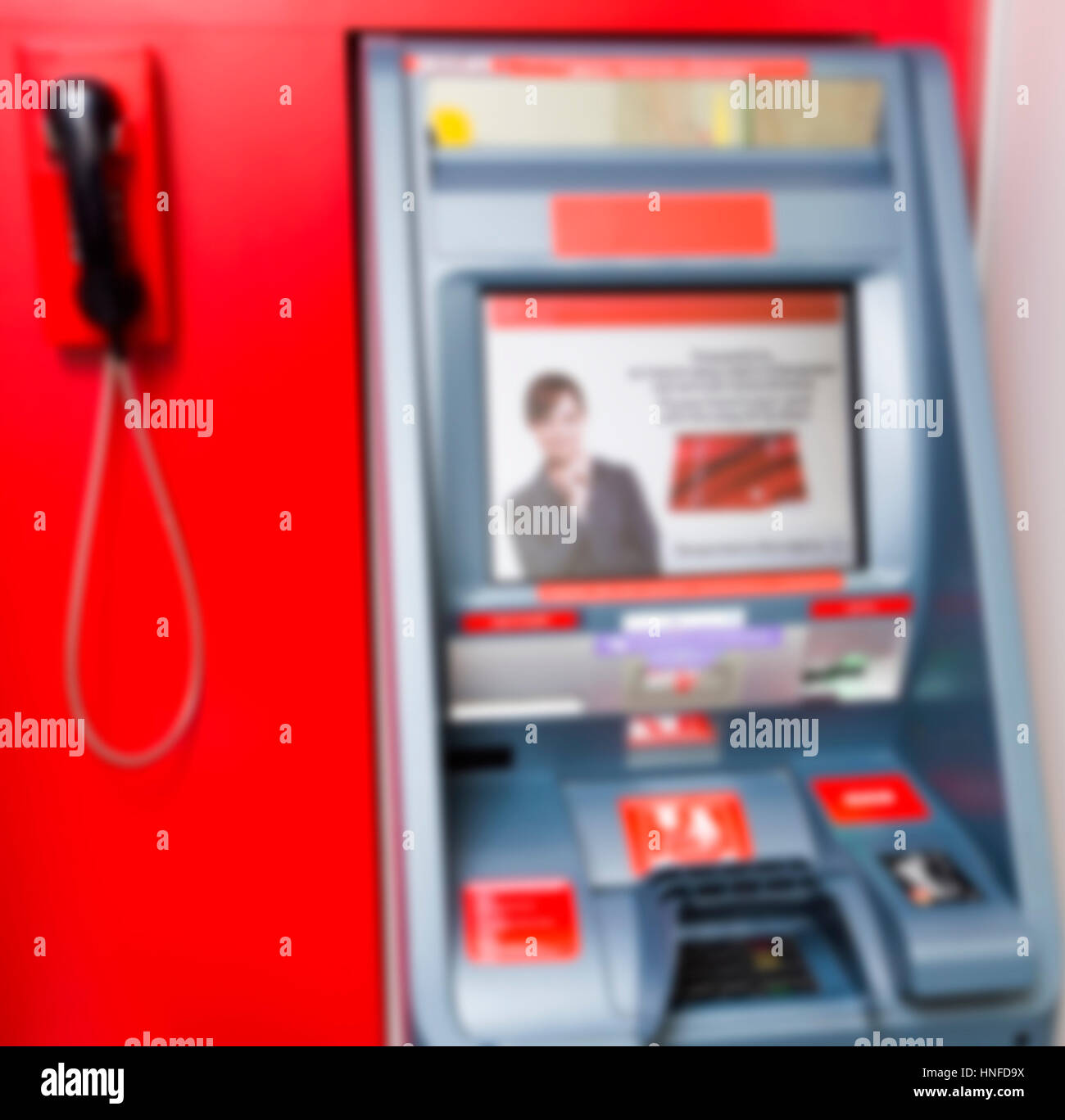 Photography of red ATM with telephone handset indoors Stock Photo - Alamy