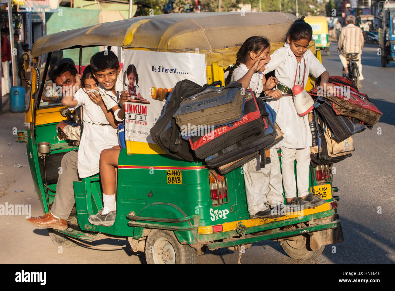 School children and their school bags on a school run to their local ...