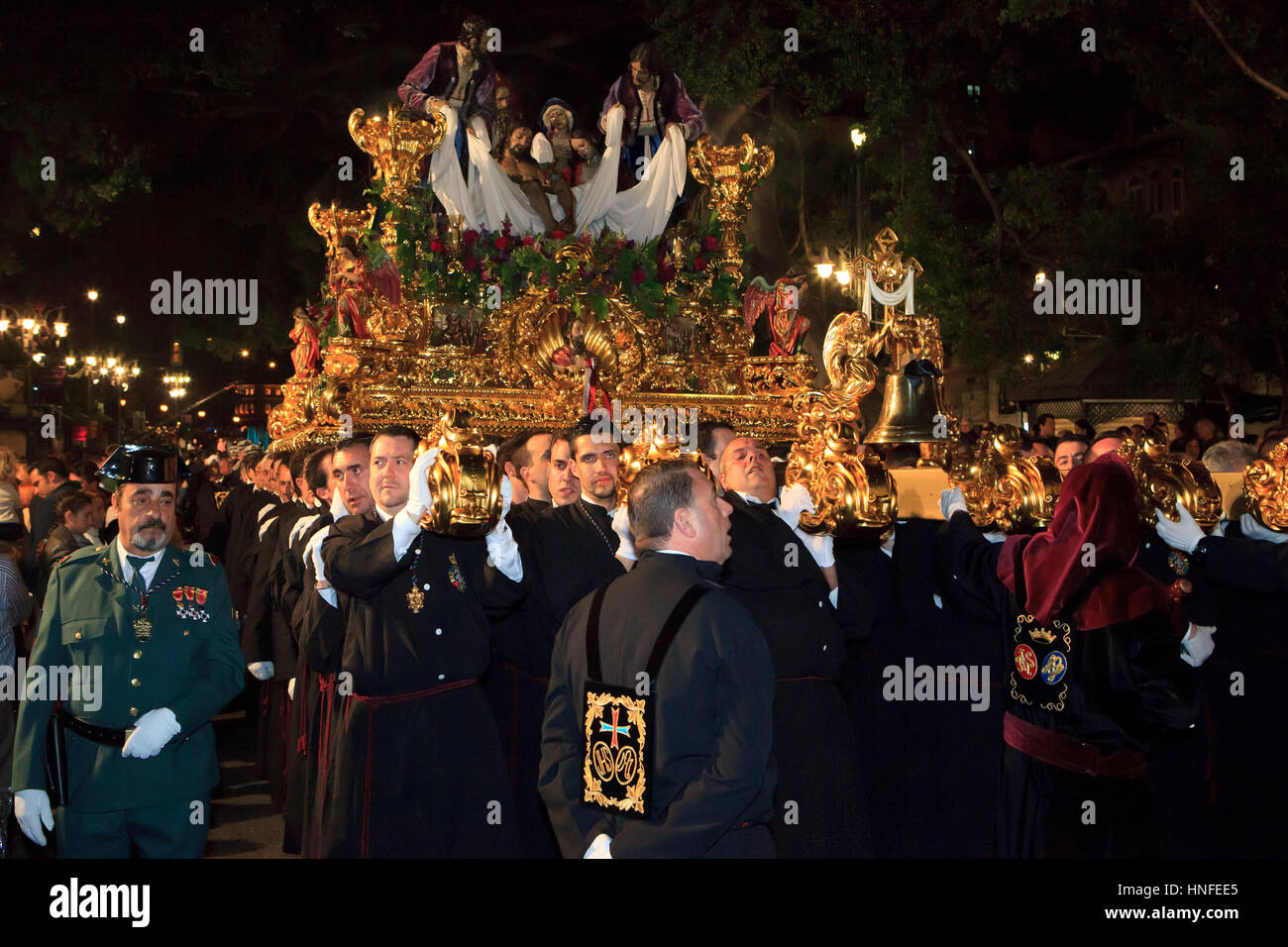 A Christian brotherhood carrying a float during the Holy Week (Semana ...
